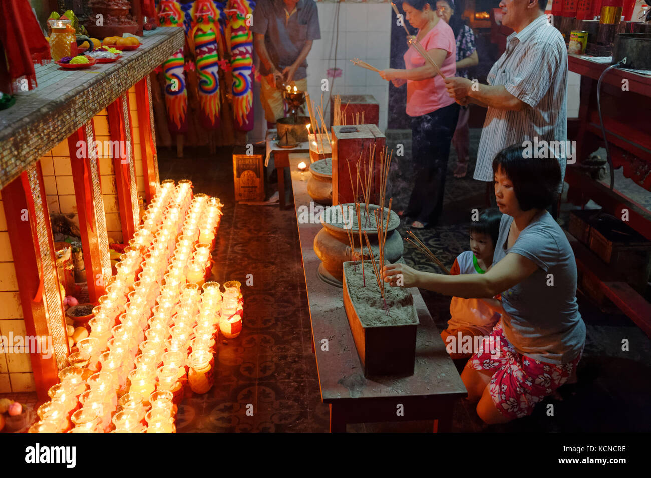 Chinese man praying at goddess mercy hi-res stock photography and ...