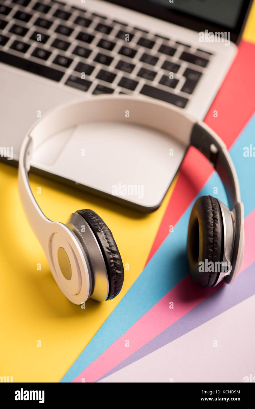 headphones and laptop computer closeup. online music concept Stock ...