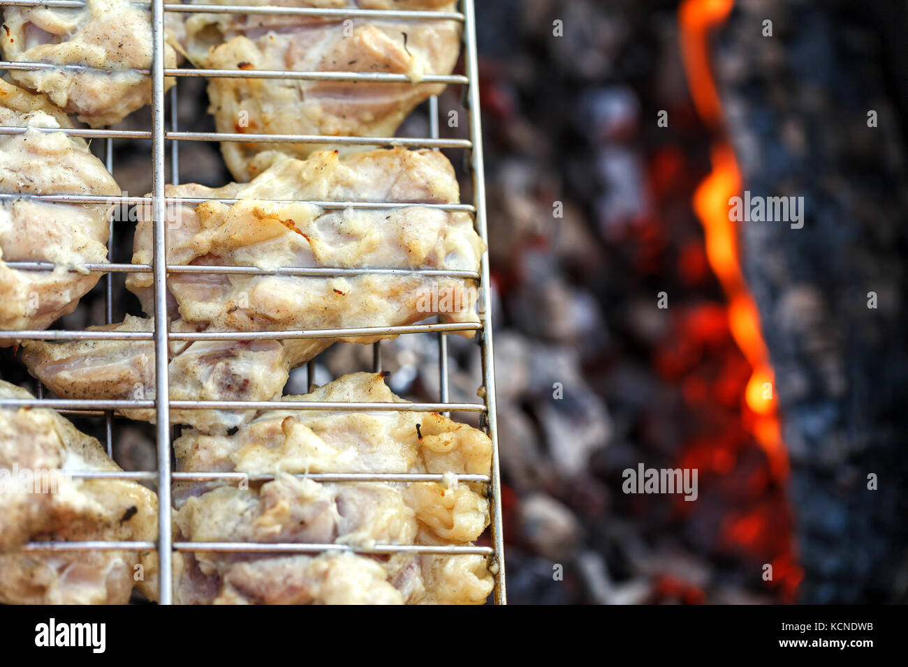 Chicken meat fried on a barbecue grill. Outdoors Stock Photo - Alamy