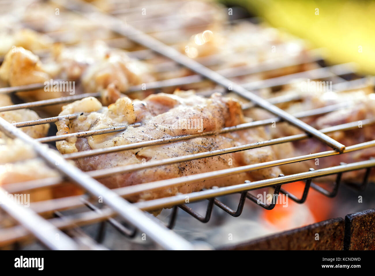 Chicken meat fried on a barbecue grill. Outdoors Stock Photo - Alamy