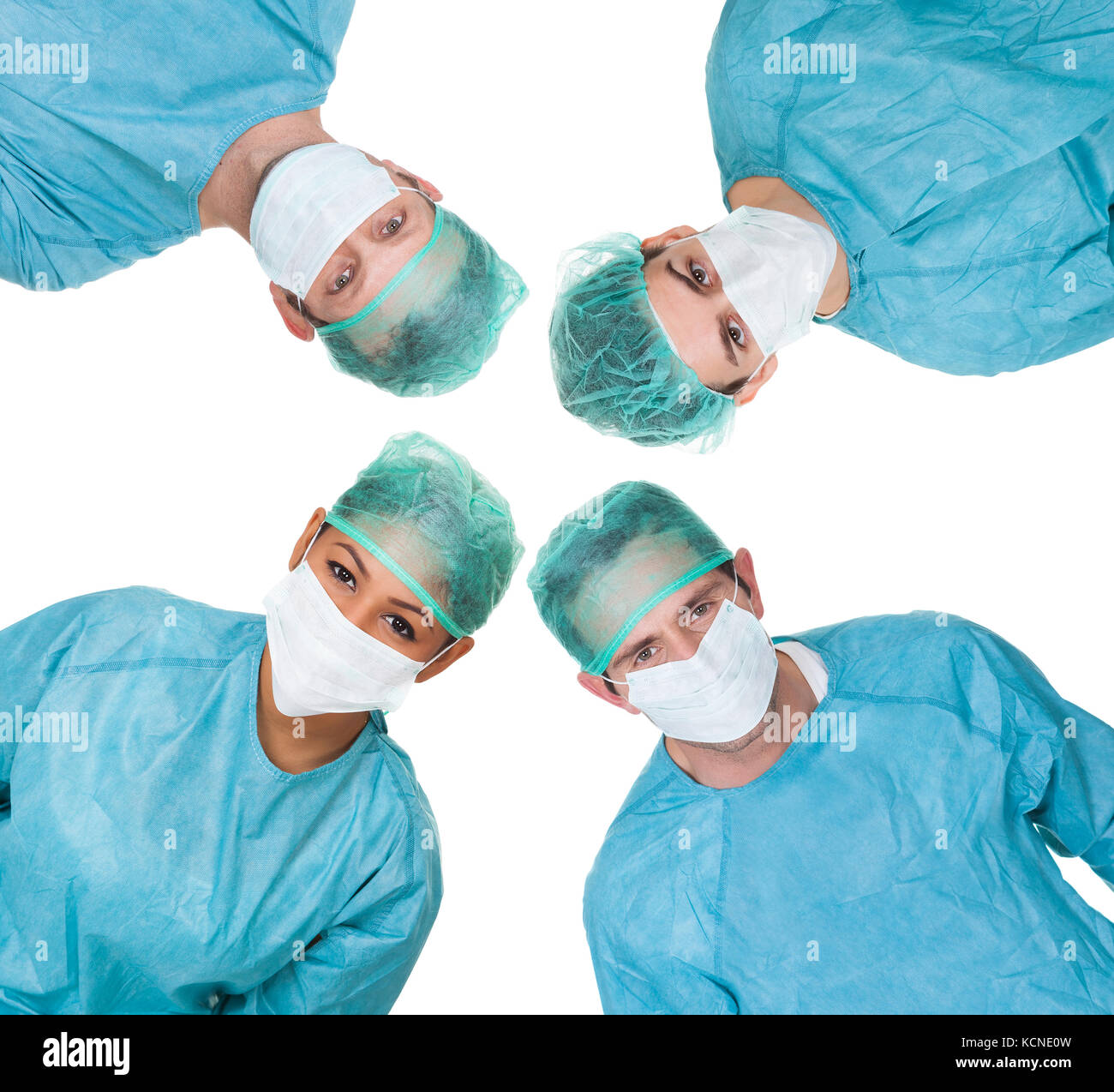 Four surgeon looking down at patient. Isolated on white Stock Photo - Alamy