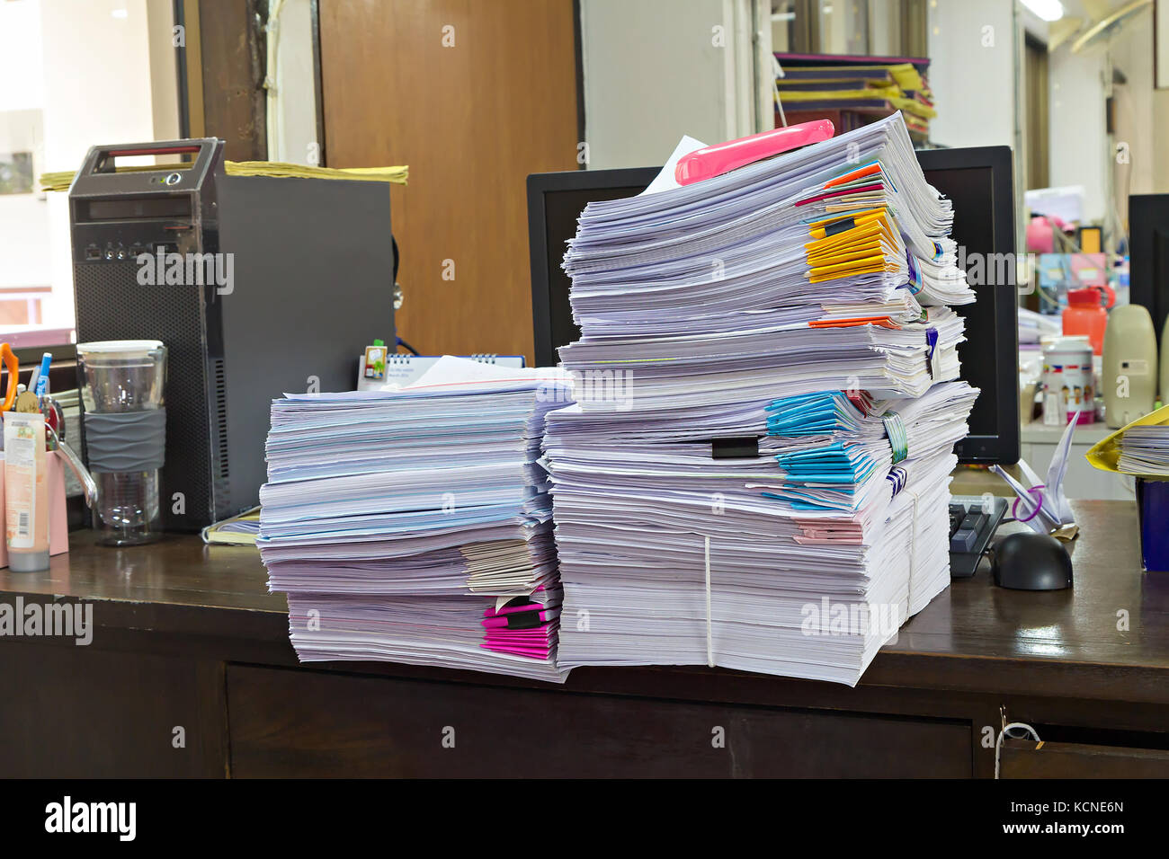 Stack of Documents and computer on the office desk Stock Photo - Alamy
