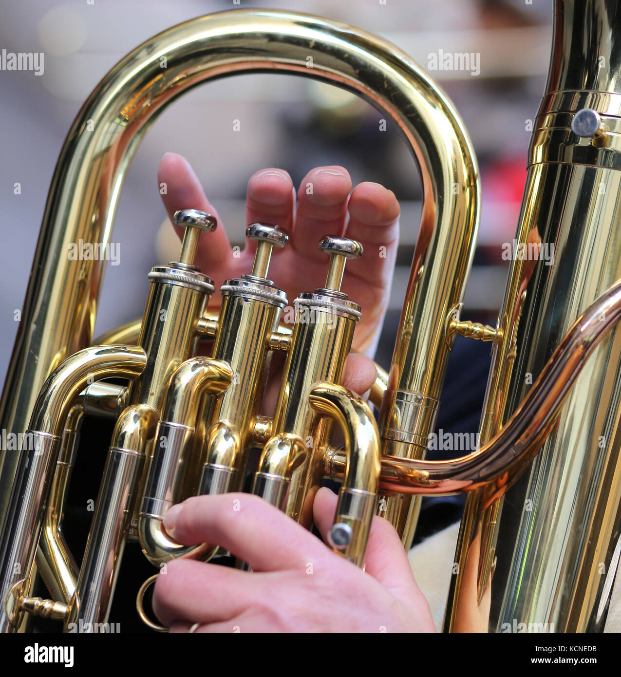 hand of boy plays the trombone in the brass band during sound ...