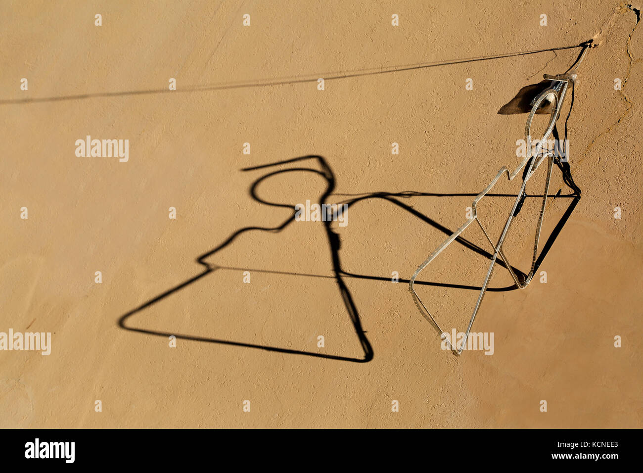 silhouette of an angel and shadow projected on the wall Stock Photo - Alamy