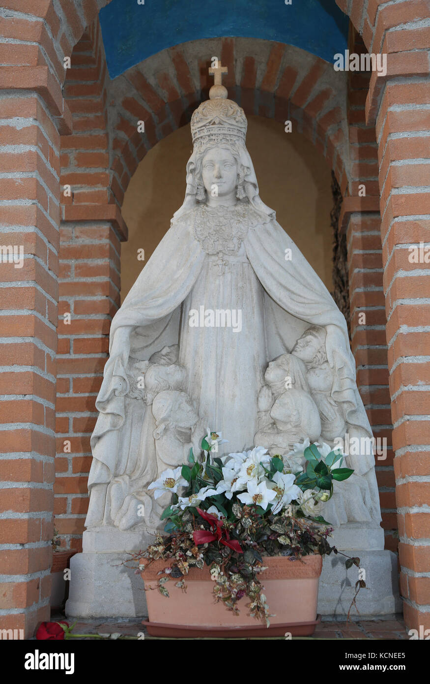 statue of our Lady with the faithful under his protective cloak Stock ...