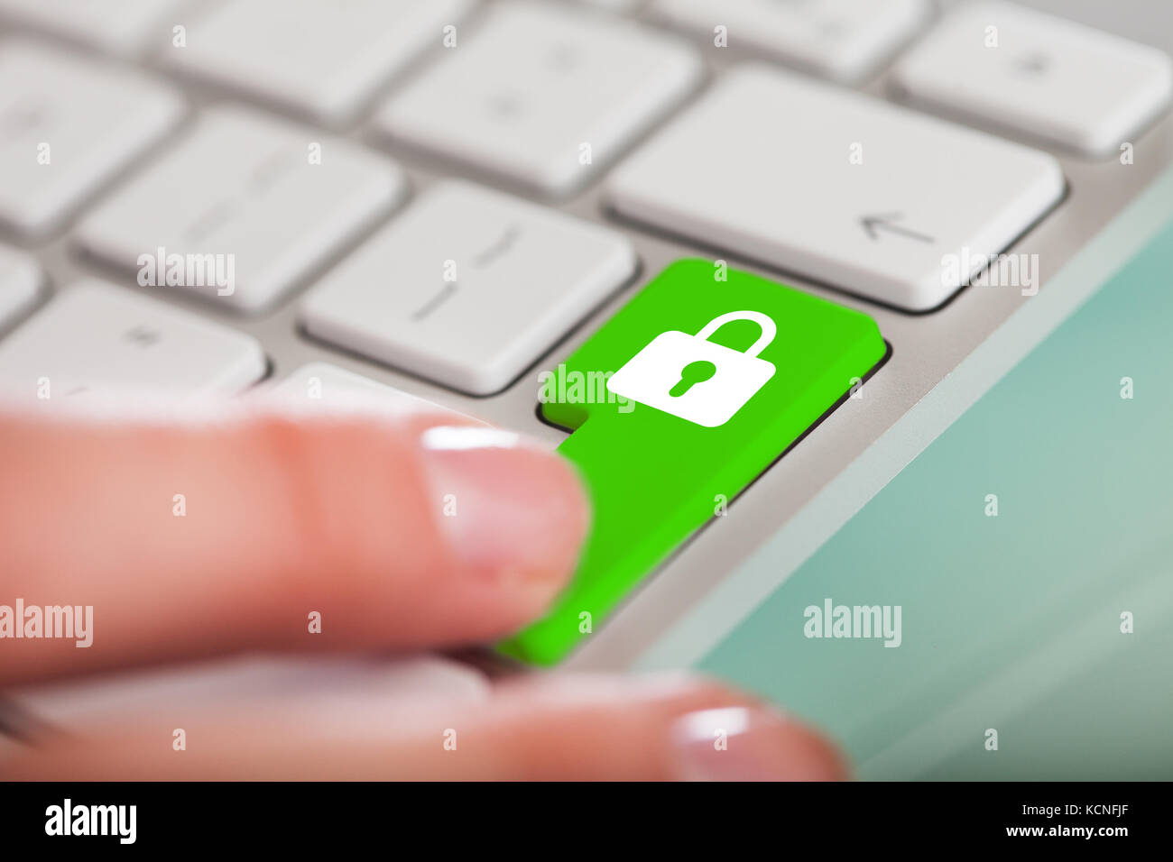 Close-up Of Hand Over Green Key With Lock Sign On Keyboard Stock Photo ...
