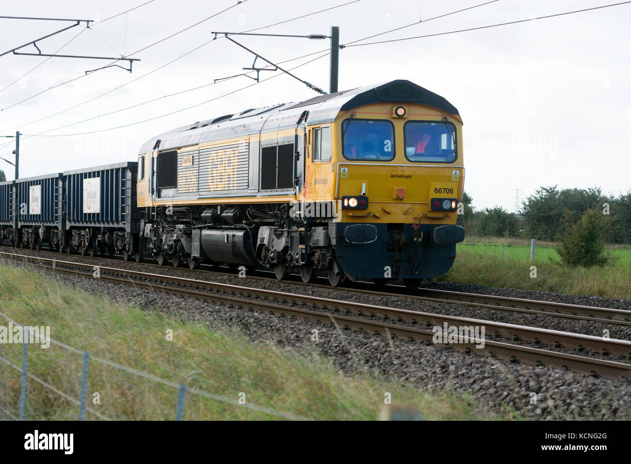 A class 66 diesel locomotive pulling a GB Railfreight train on the East ...