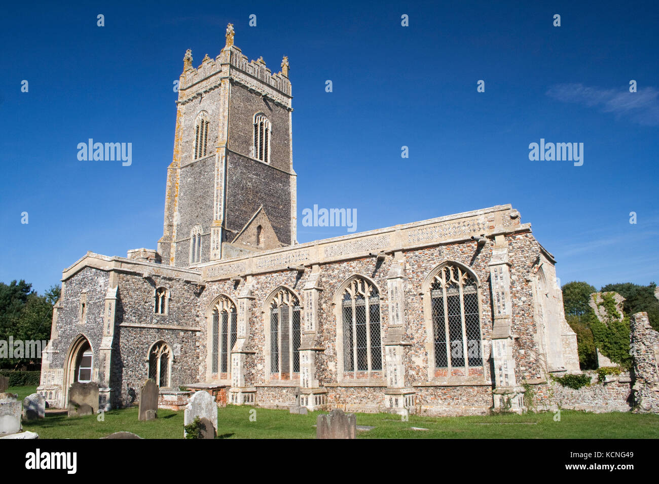 Church of St Andrew, Walberswick, Suffolk, England, against a blue sky ...