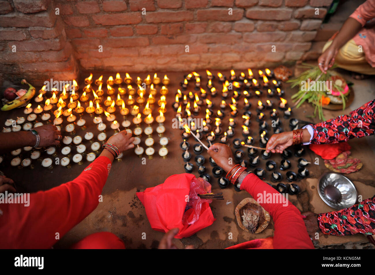 Kathmandu, Nepal. 06th Oct, 2017. Devotees offering butter lamps during ...