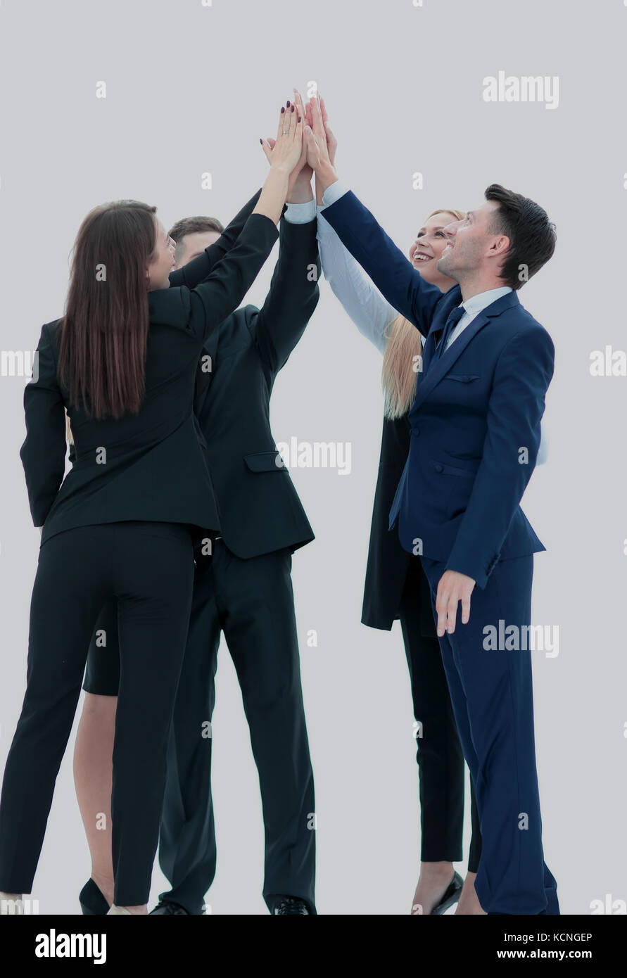 Happy successful business team giving a high fives gesture as they ...