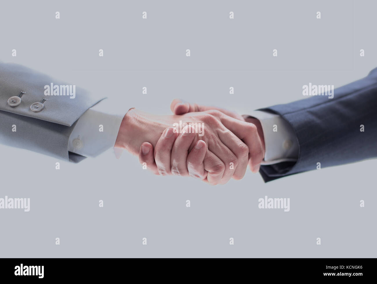 Business partners shaking hands Stock Photo - Alamy