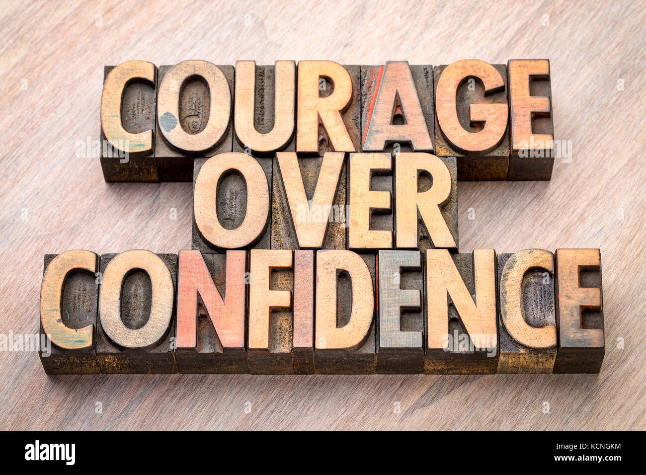 courage over confidence word abstract in vintage letterpress wood type ...