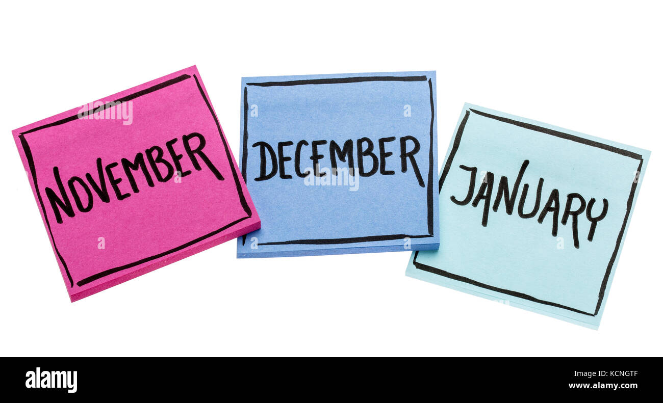 November, December and January - handwriting in black ink on isolated ...