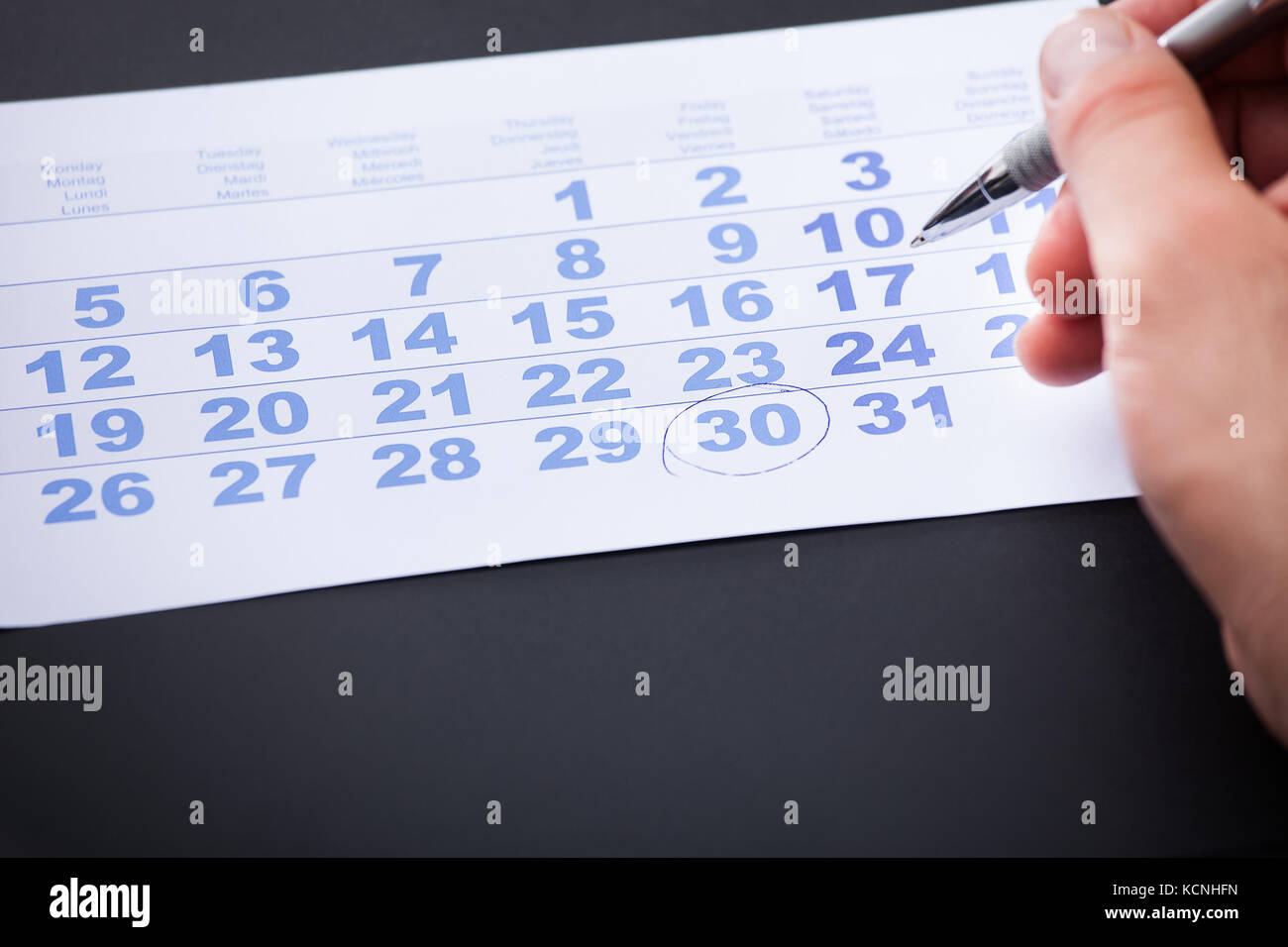 Close-up Of Businessman Marking With Pen And Looking At Date On ...