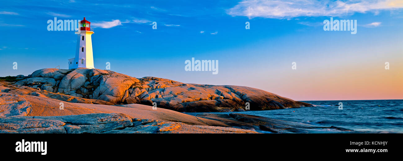 Panoramic photo of Peggys Cove Lighthouse and rock formations during ...