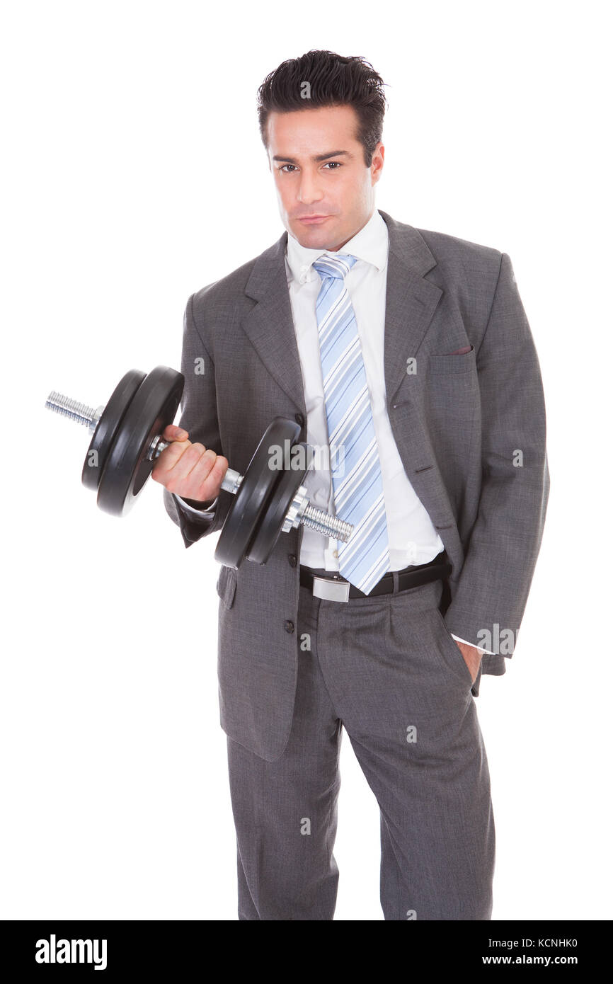 Portrait Of Young Businessman Exercising With Dumbbells Stock Photo - Alamy