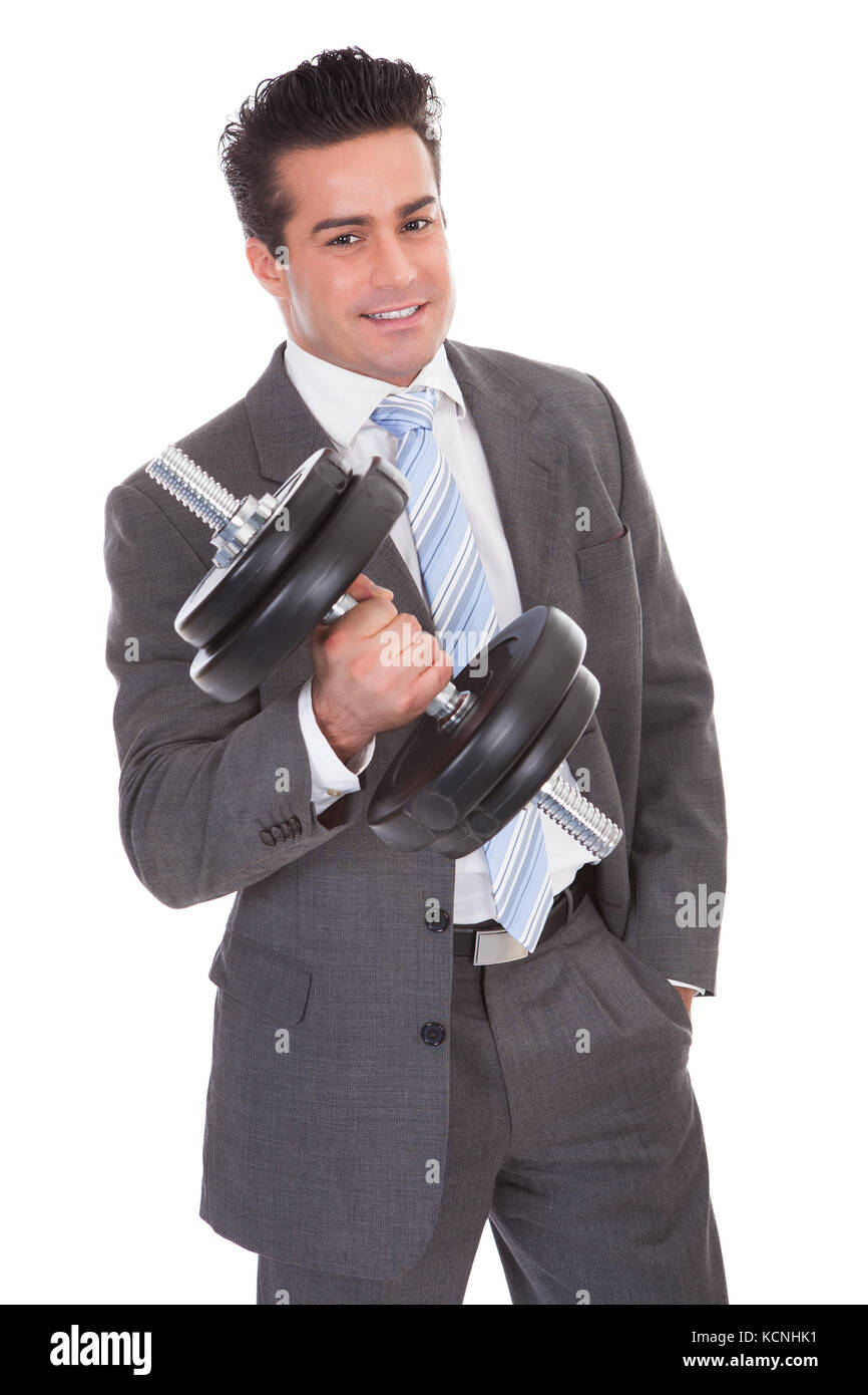 Portrait Of Young Businessman Exercising With Dumbbells Stock Photo - Alamy
