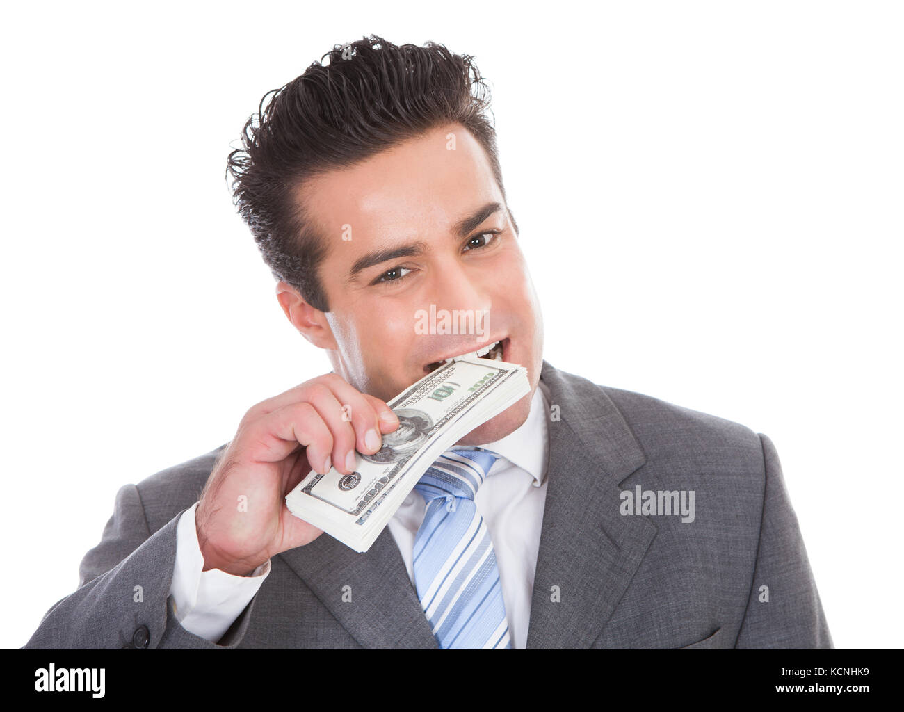 Portrait Of Young Businessman Biting Gold Bar Over White Background ...