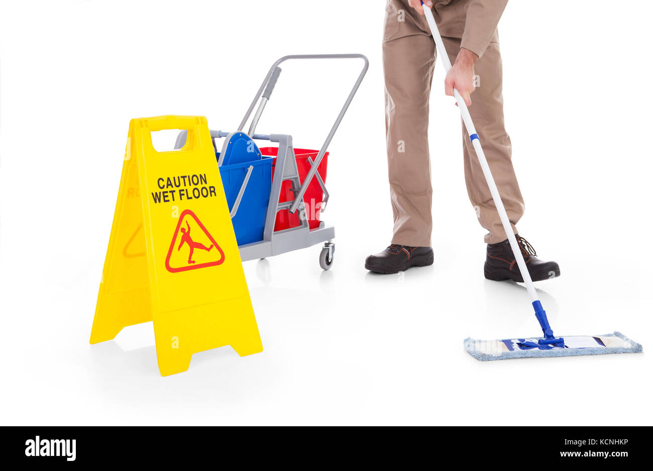 Close-up Of Male Sweeper Cleaning Floor On White Background With ...