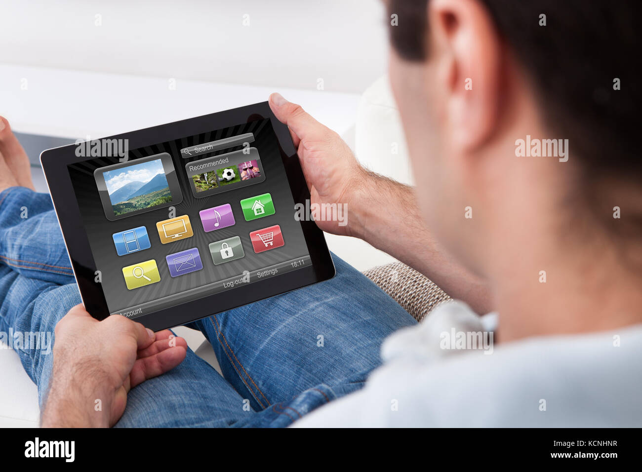 Close-up Of Man Hands Holding Tablet Pc Showing Icons Stock Photo - Alamy