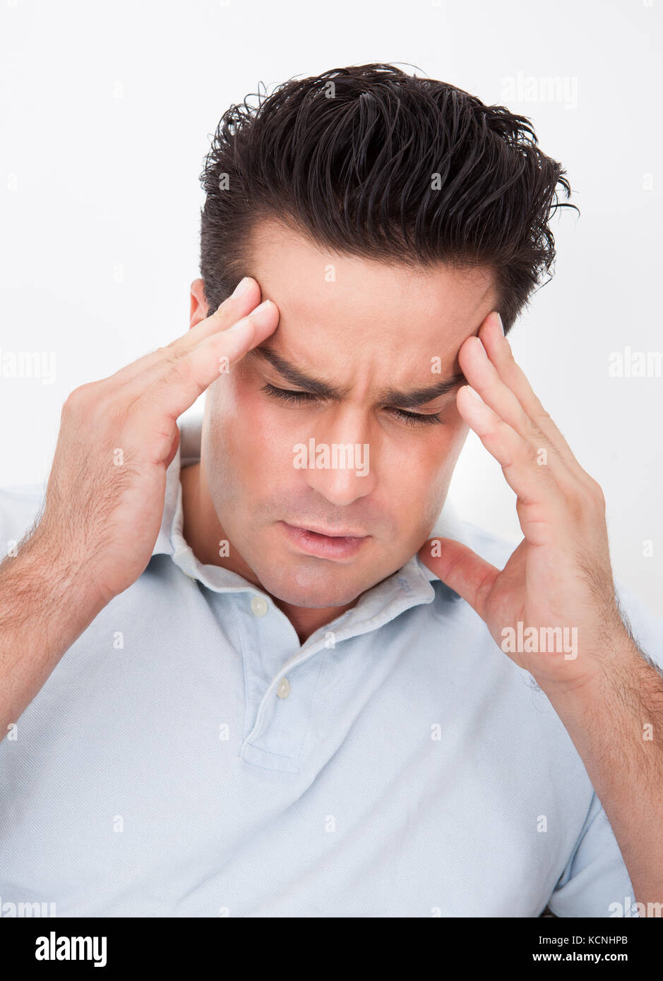 Young Man Having Headache Over White Background Stock Photo - Alamy