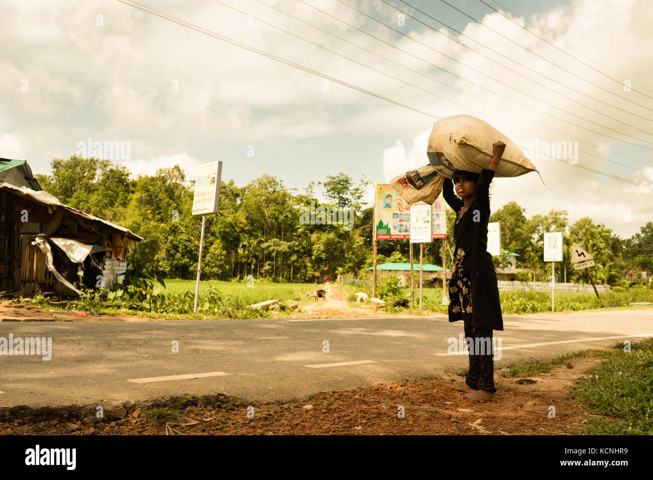 Rohingya Girl carries clothes she recieved from aid charities. Cox's ...