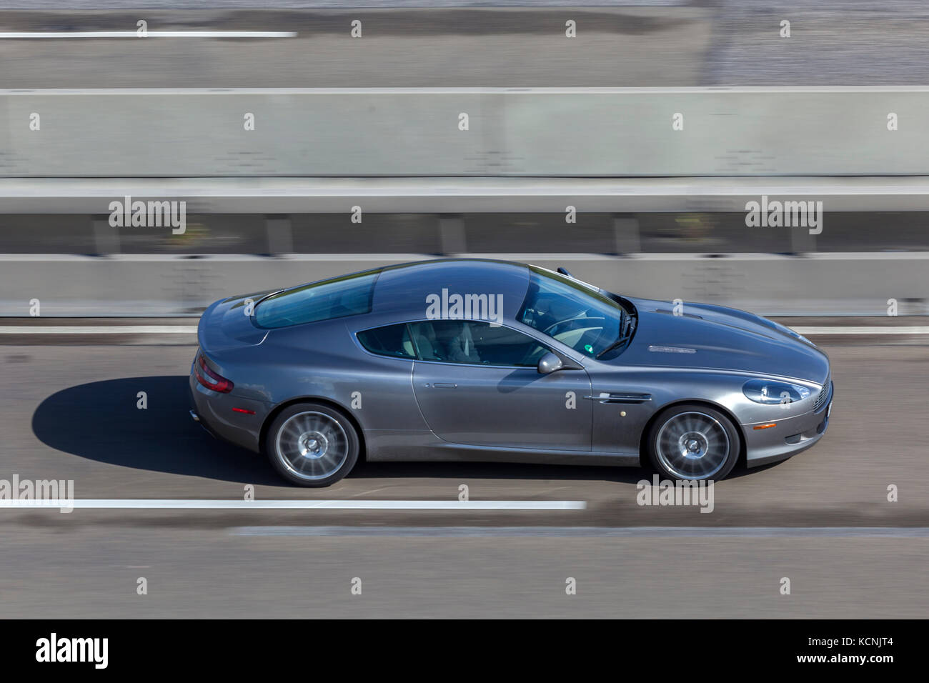 Luxury sports car driving fast on the highway Stock Photo - Alamy