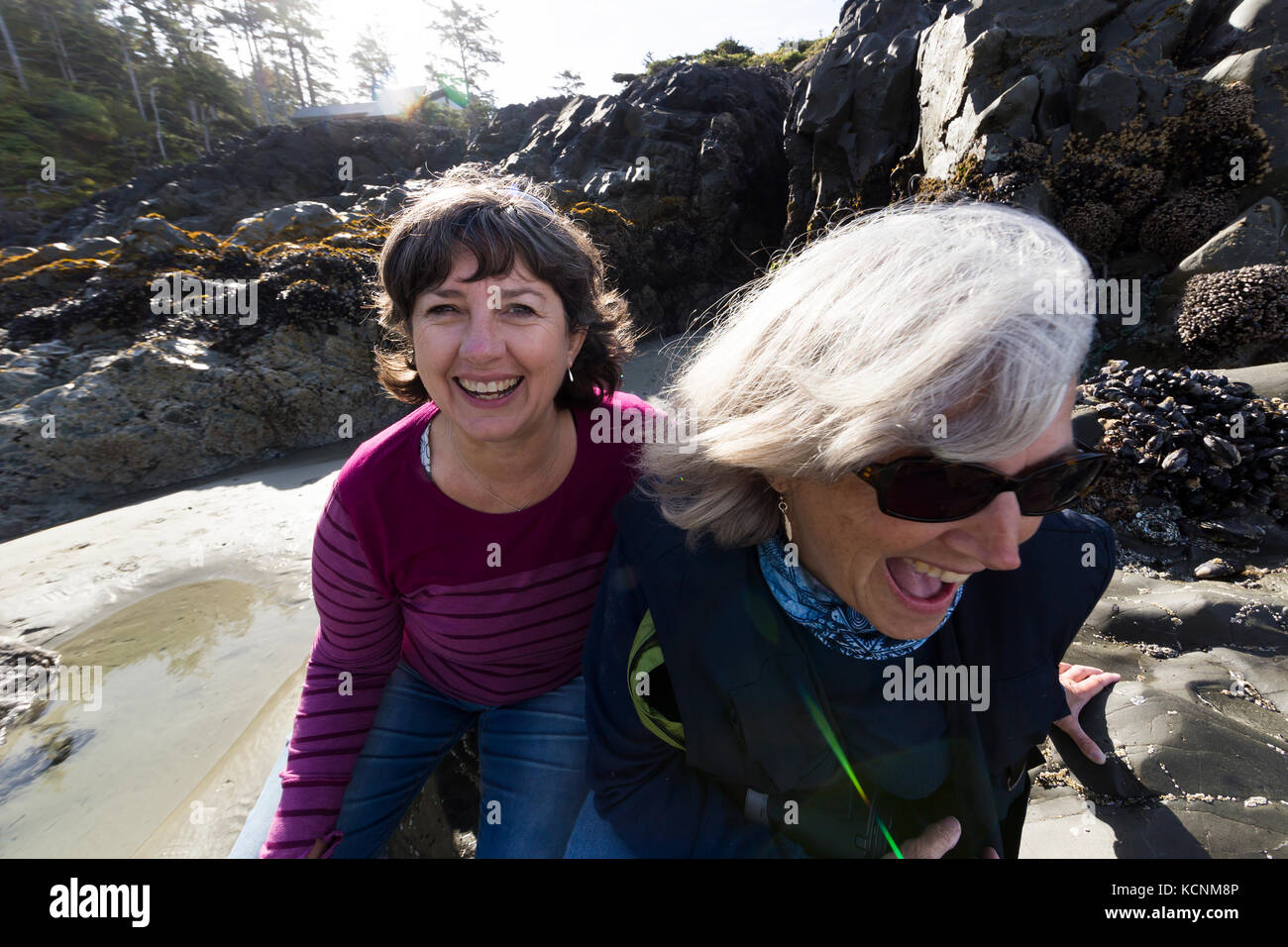 Two friends share a laugh while photographing along the shores of South ...