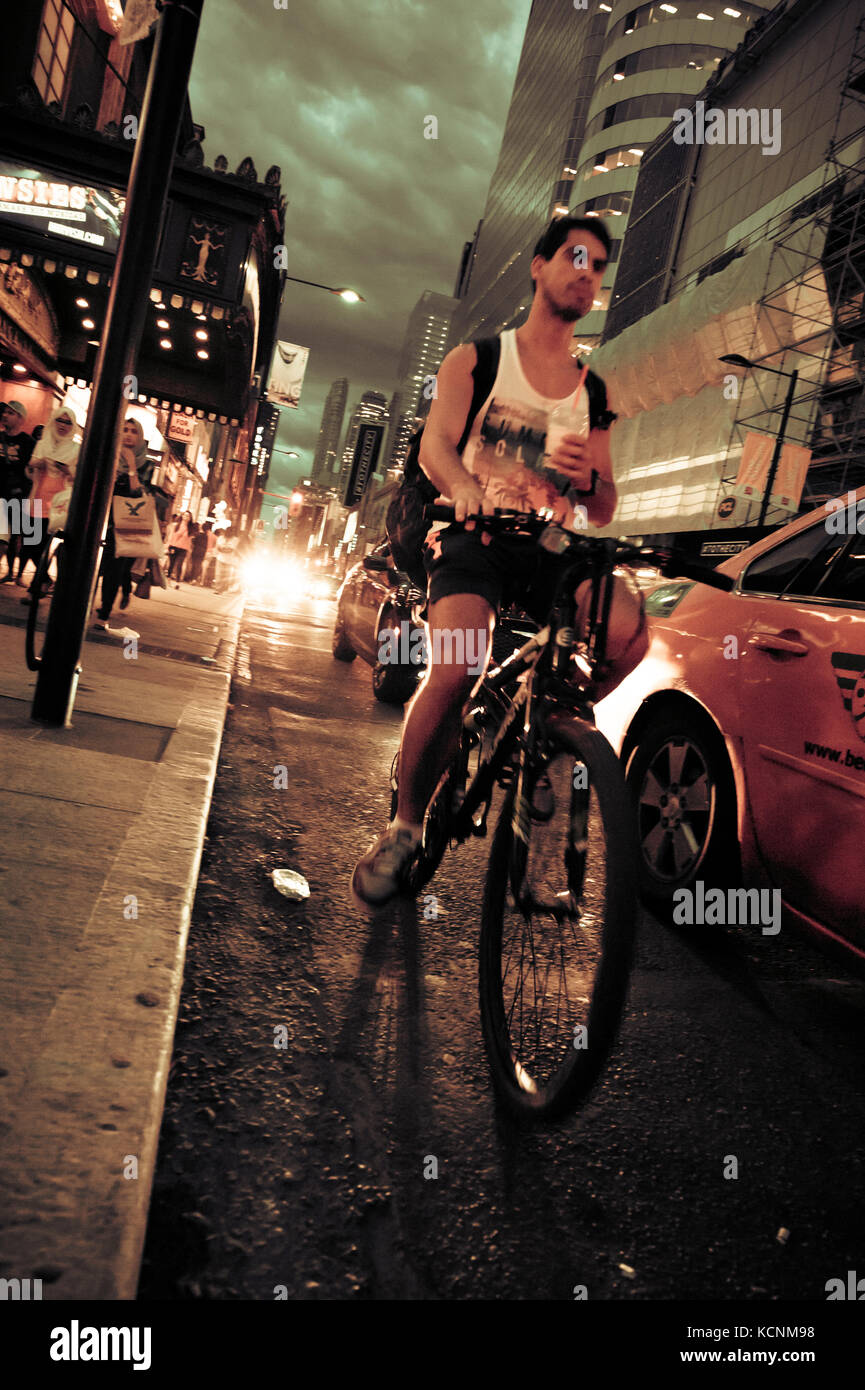 man on a bicycle on Yonge Street in Toronto Stock Photo - Alamy