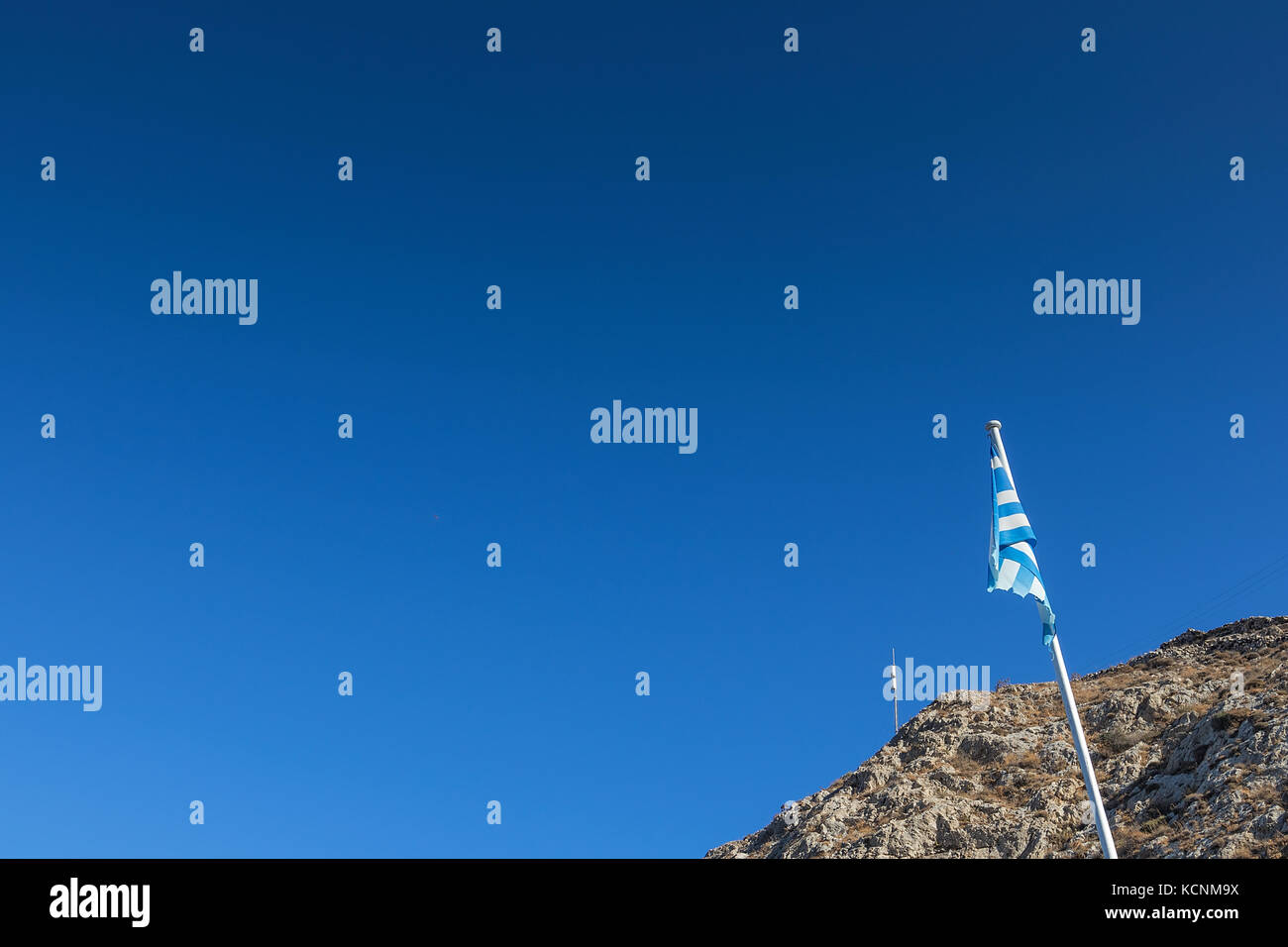 Greek flag with blue sky Stock Photo - Alamy