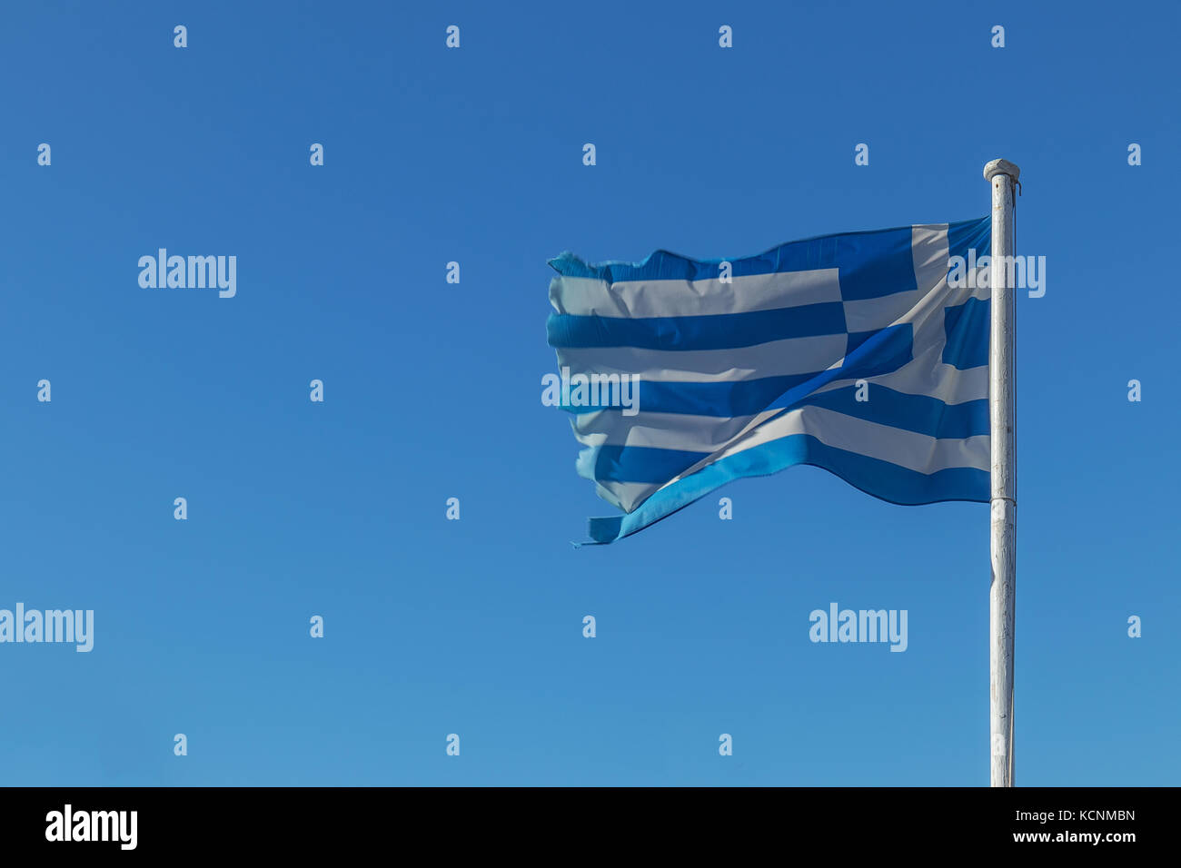 Greek flag with blue sky Stock Photo - Alamy