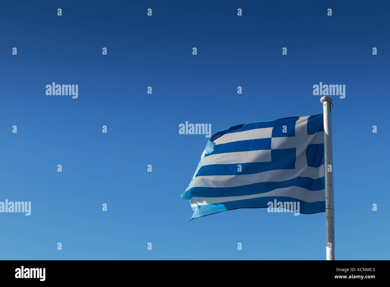 Greek flag with blue sky Stock Photo - Alamy