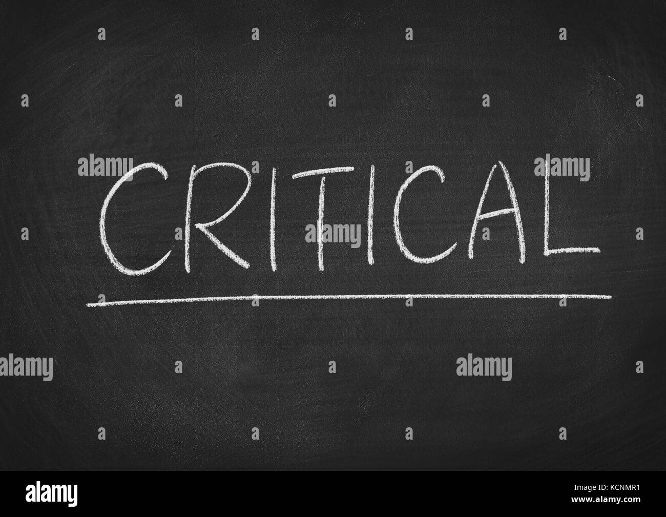 critical concept word on a blackboard background Stock Photo - Alamy