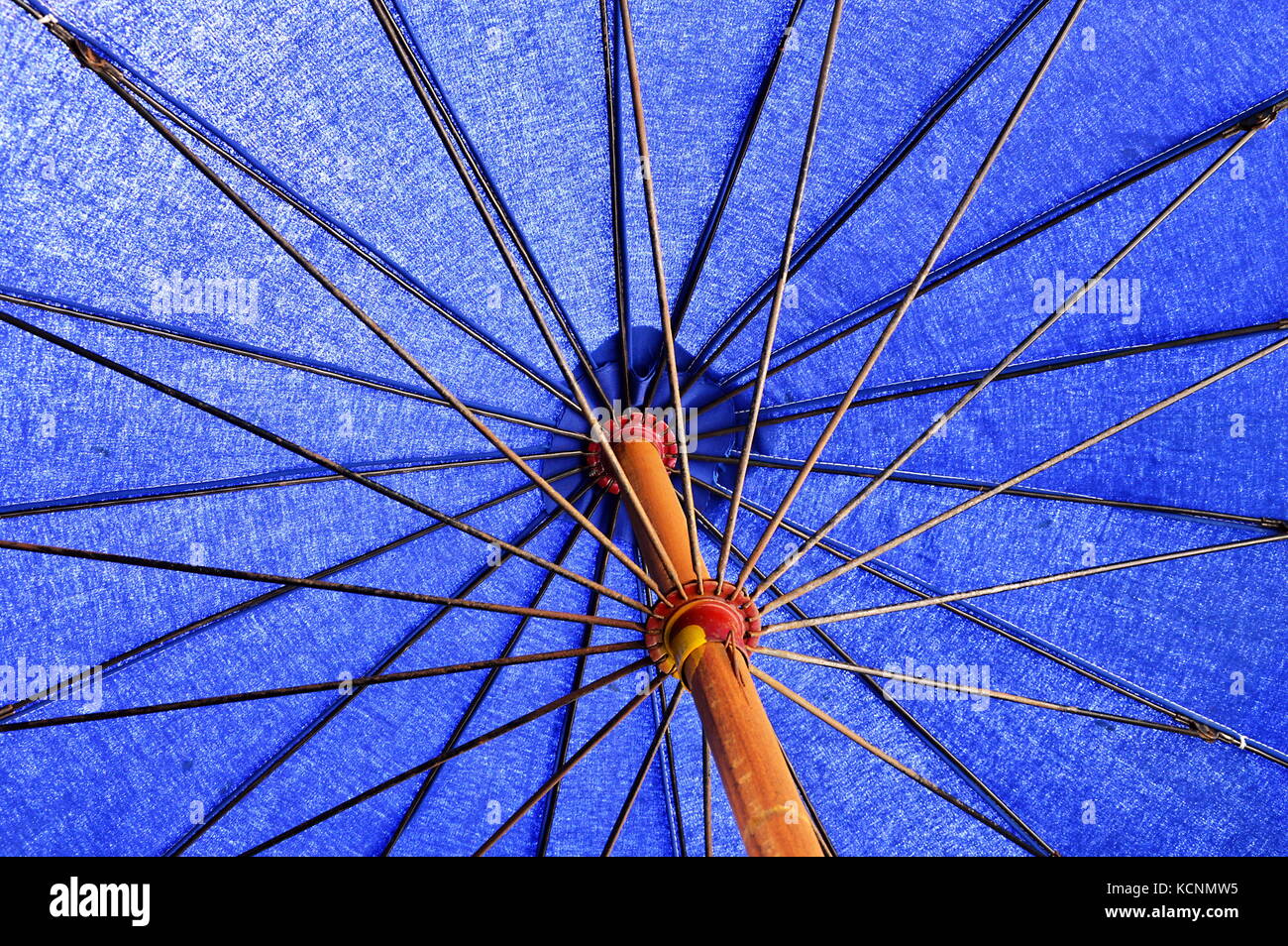 blue umbrella with long wooden handle Stock Photo - Alamy