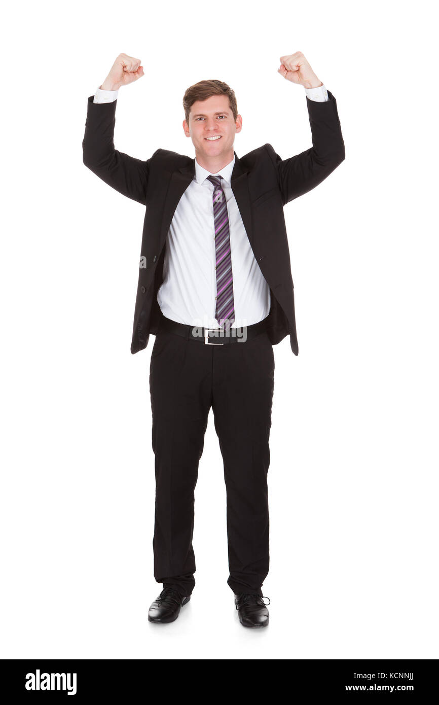 Portrait of happy businessman raising hand isolated over white ...