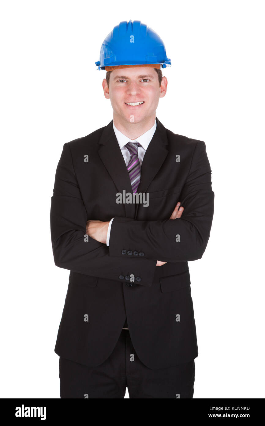 Portrait of successful male architect standing on white background ...