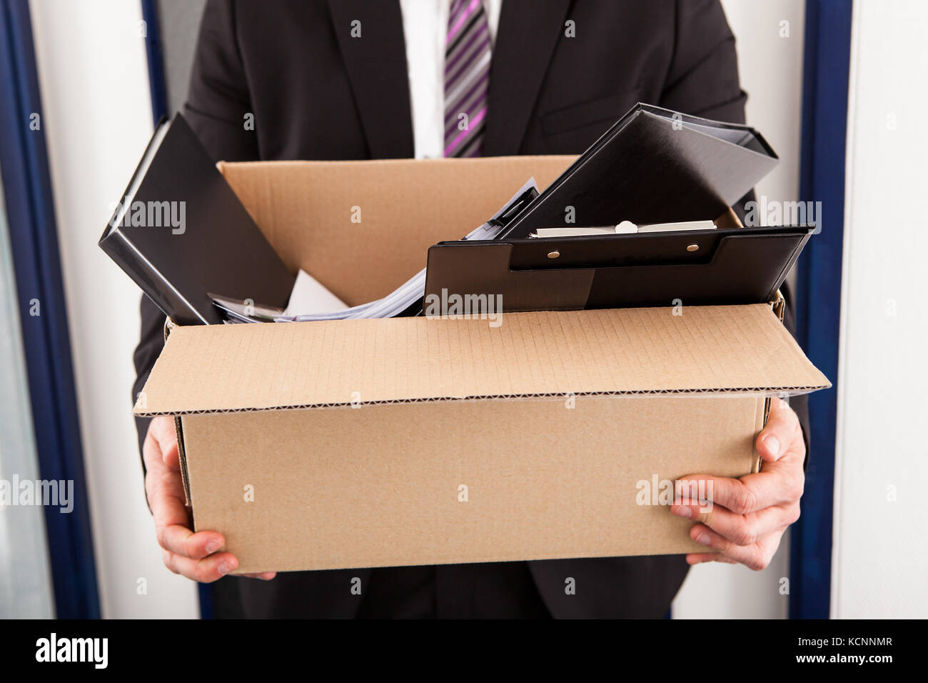 Young man carrying files portrait hi-res stock photography and images ...