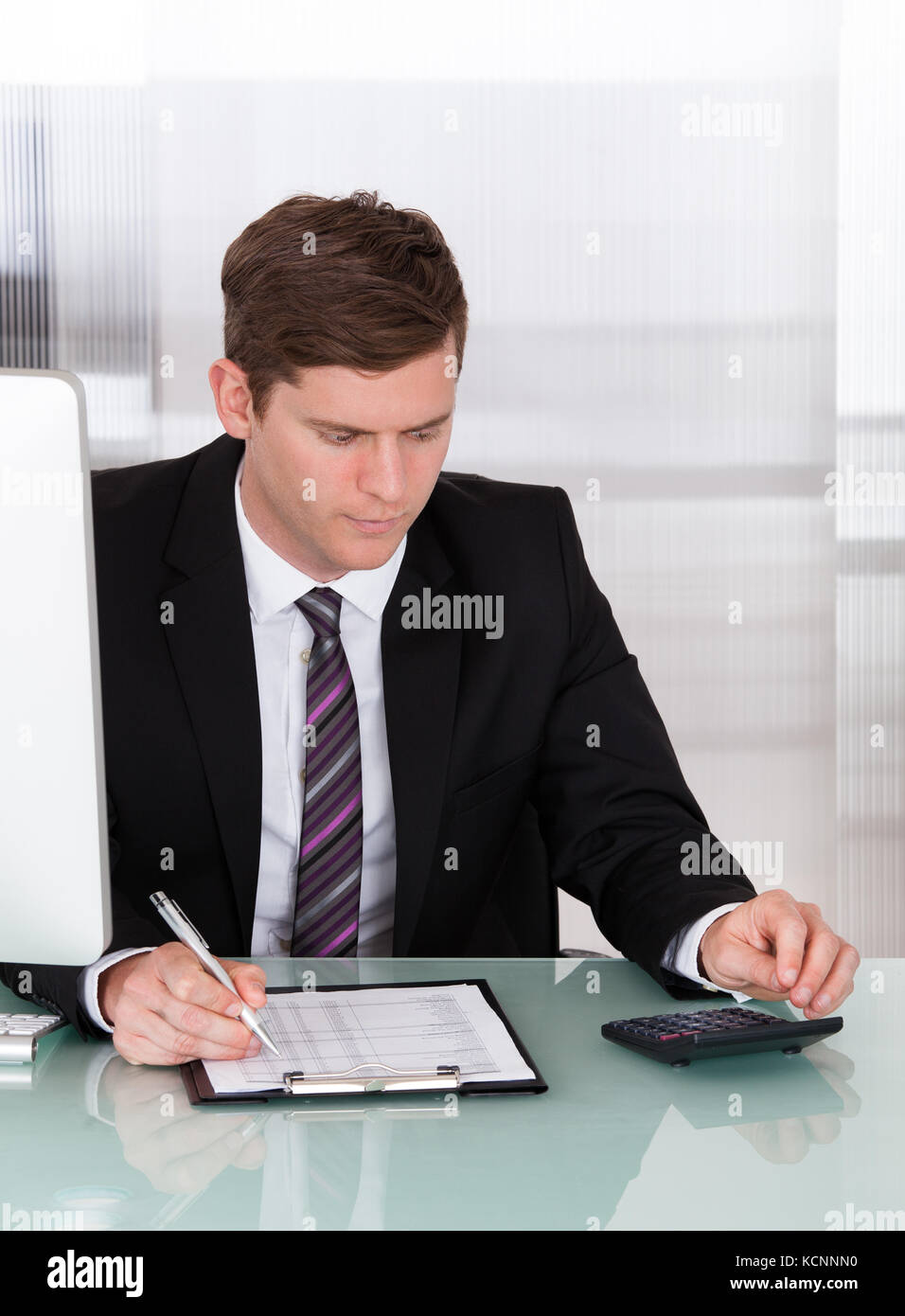 Businessman calculator in office room hi-res stock photography and ...