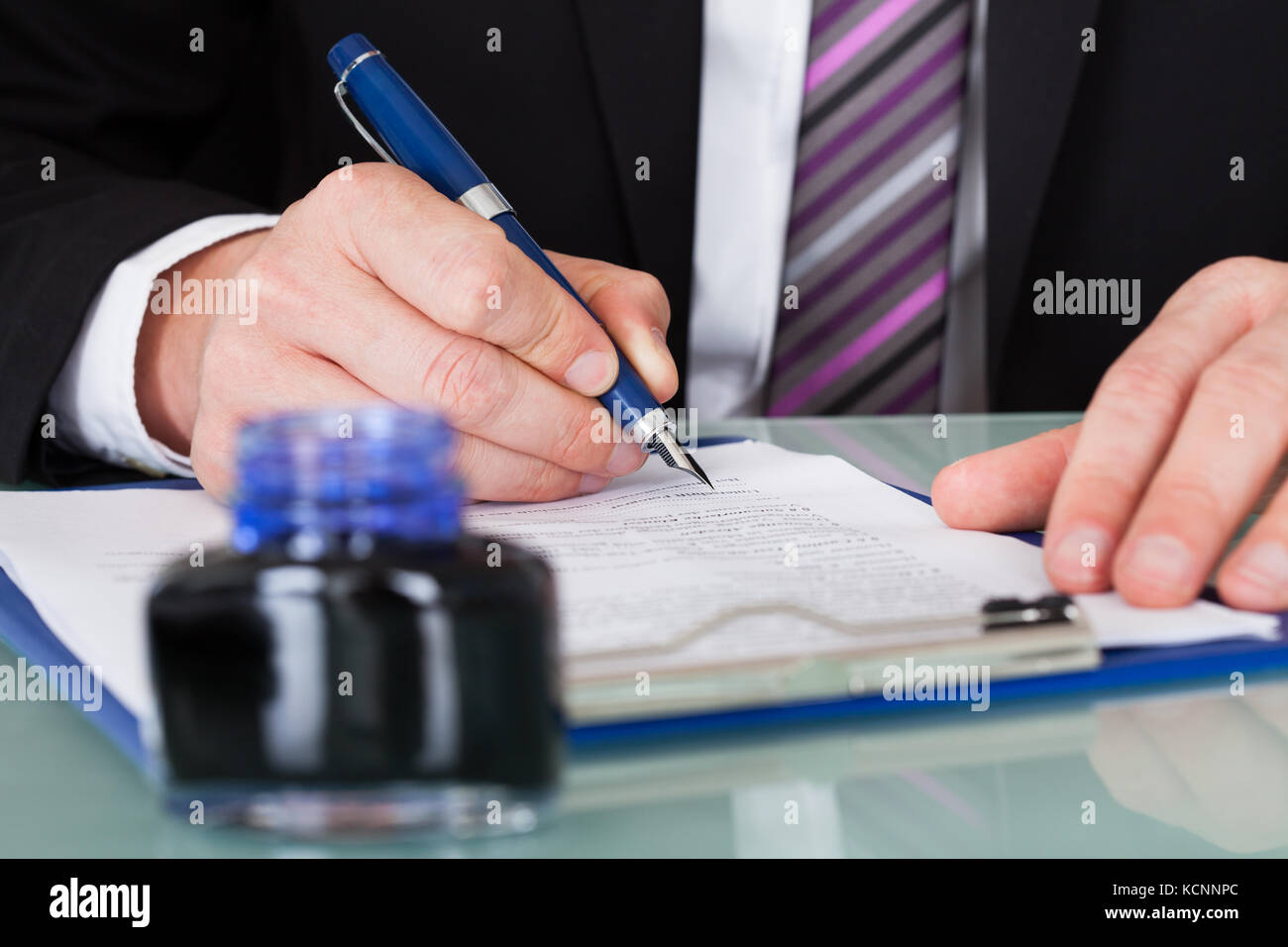 Close-up Of Businessman Hand Writing With Ink Pen Over Document Stock ...