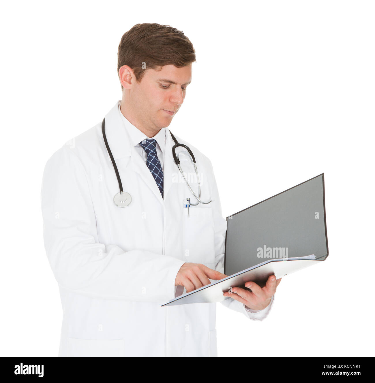 Young Male Doctor Checking Records Over White Background Stock Photo ...