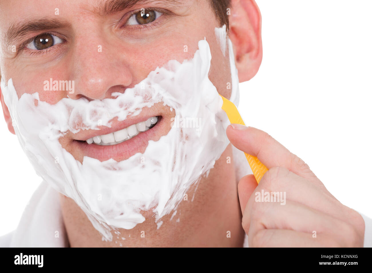 Close Up On A Young Man Shaving His Beard With A Razor Stock Photo - Alamy