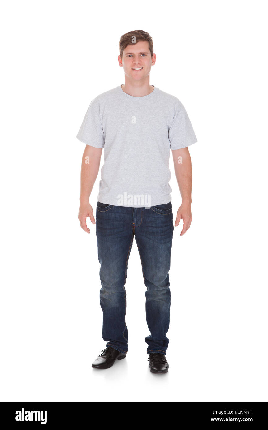Young Happy Man Standing Over White Background Stock Photo - Alamy