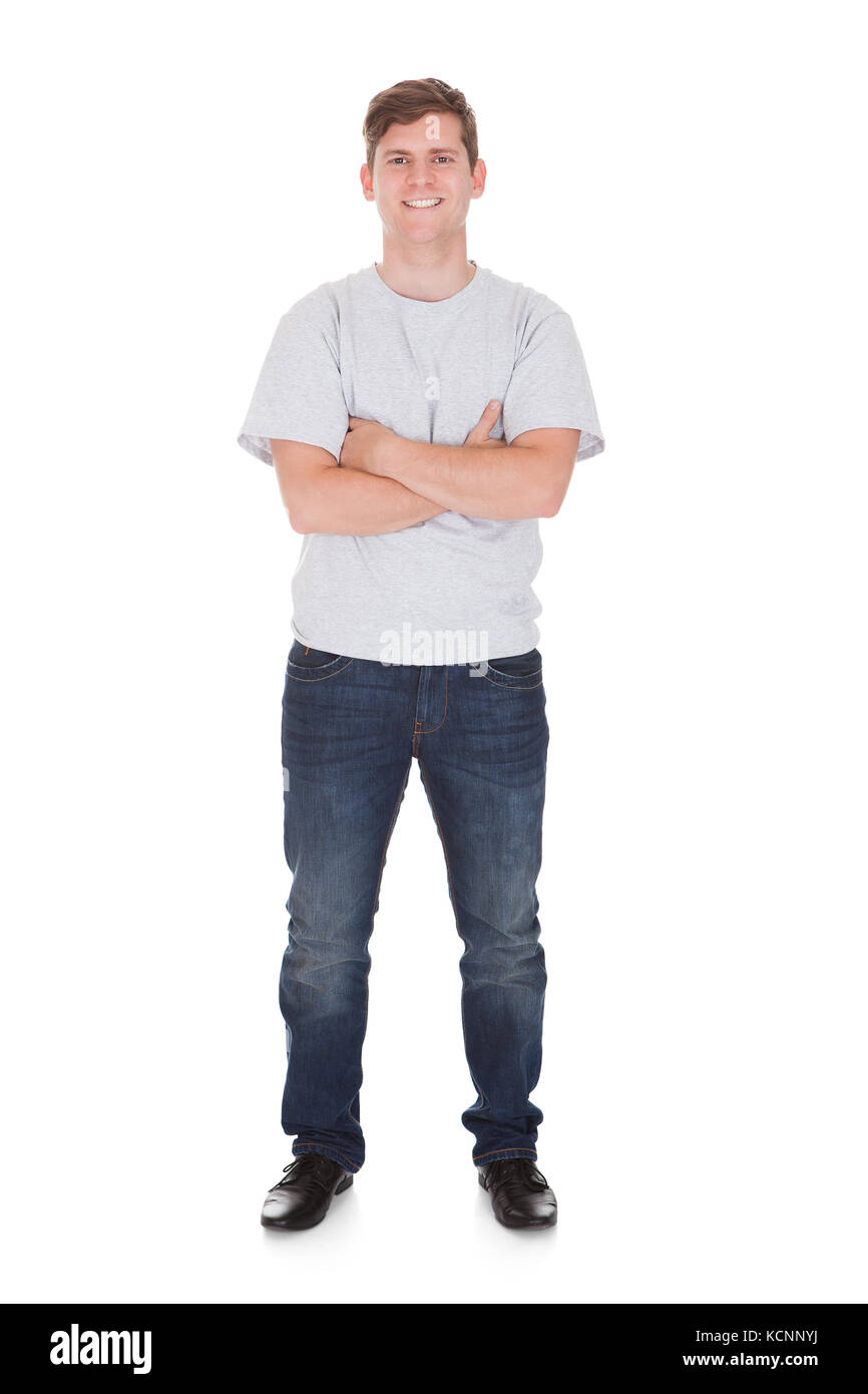Young Happy Man Standing Over White Background Stock Photo - Alamy