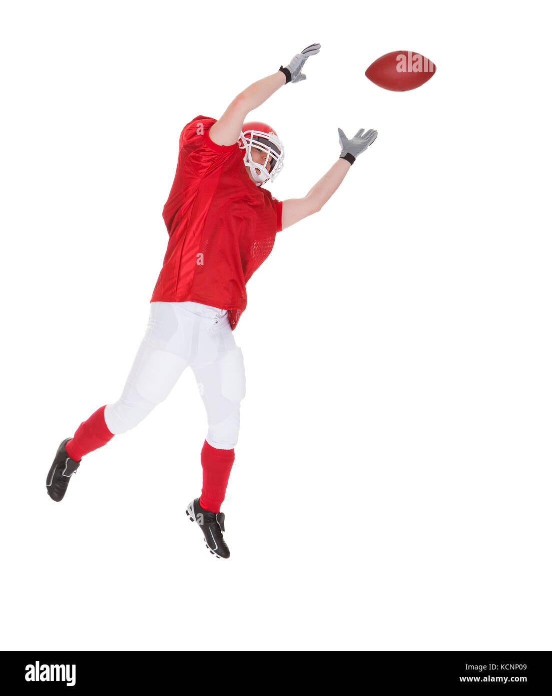 Portrait Of American Football Player Catching A Ball Over White ...