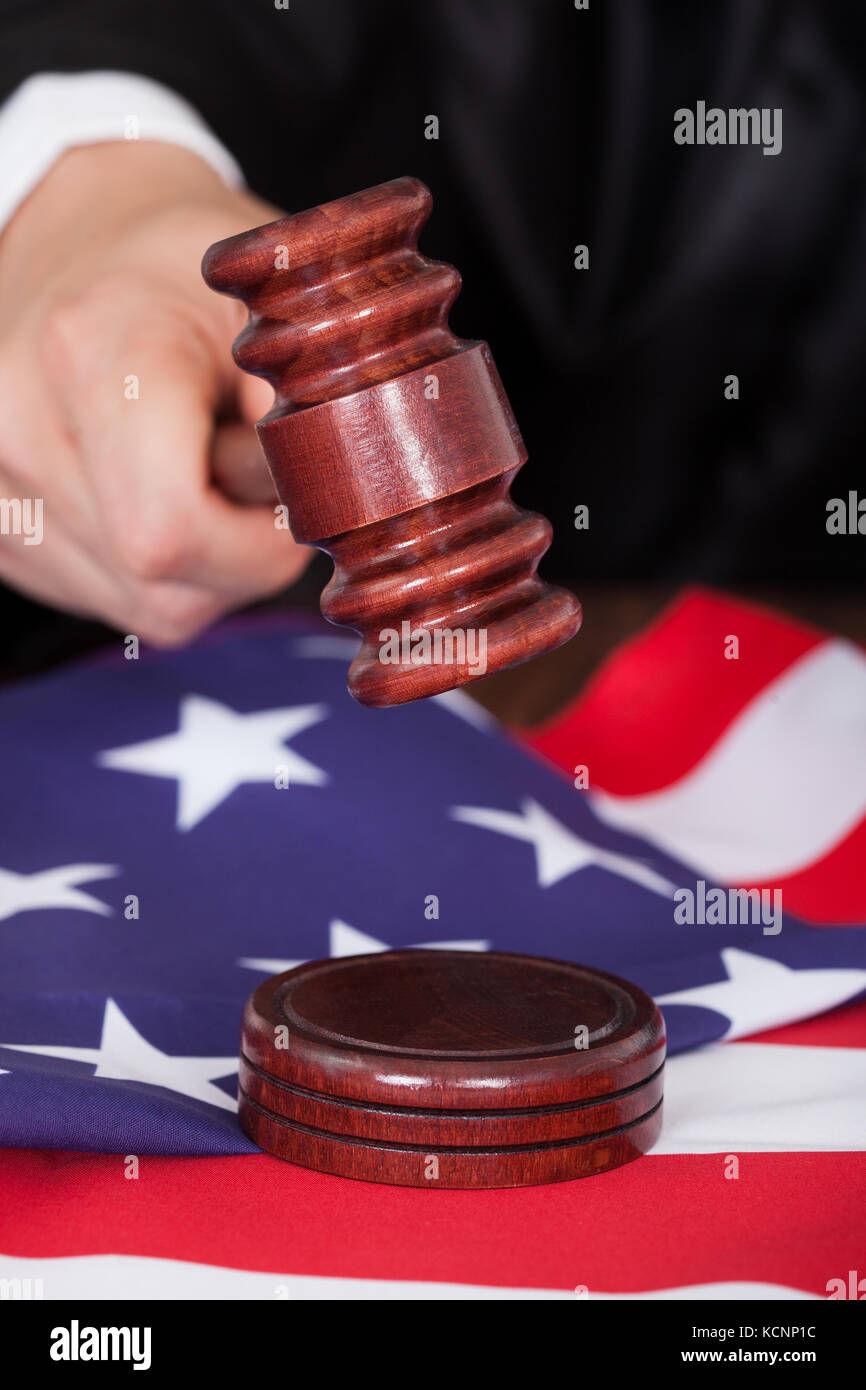 Close-up Of Male Judge Hand Striking The Gavel In A Courtroom Stock ...