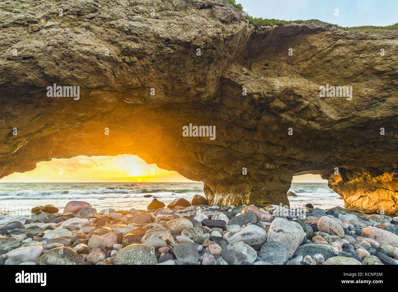 Sunset Through the Arches, Lime Stone rock formation, the Arches ...