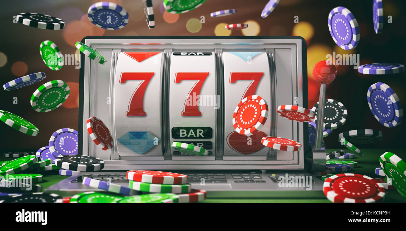 Online gambling concept. Slot machine on a laptop screen and flying ...