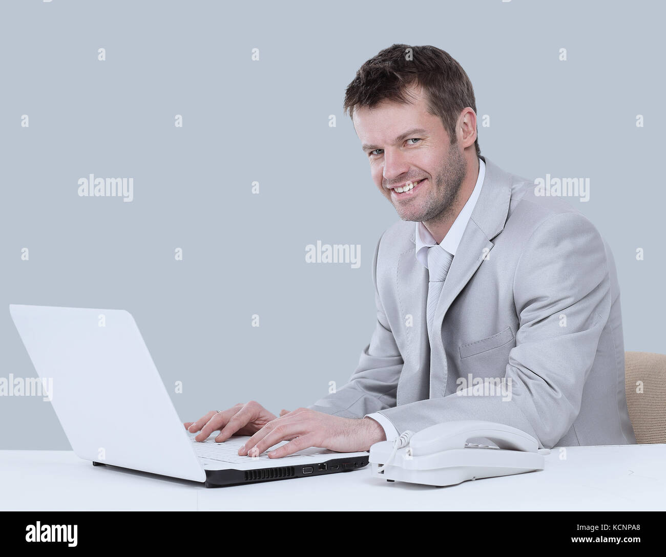 Happy middle aged business man working on computer Stock Photo - Alamy