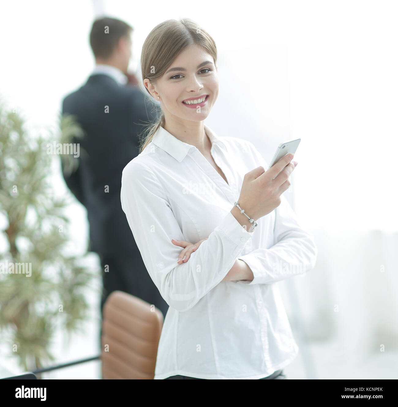 young professional reading SMS on smartphone Stock Photo - Alamy