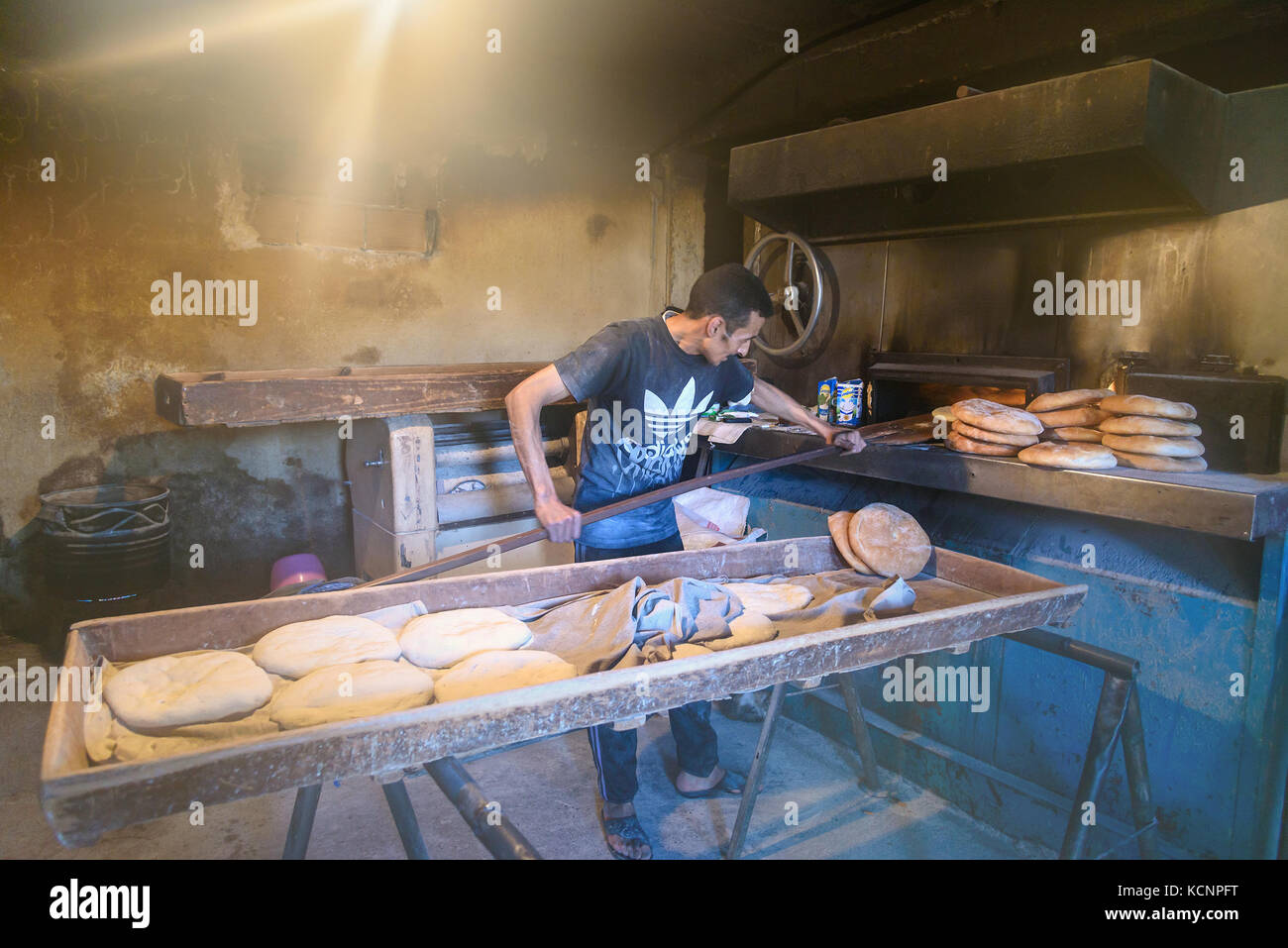 Imilchil, Morocco - Jan 10, 2017: Worker in traditional bread bakery ...